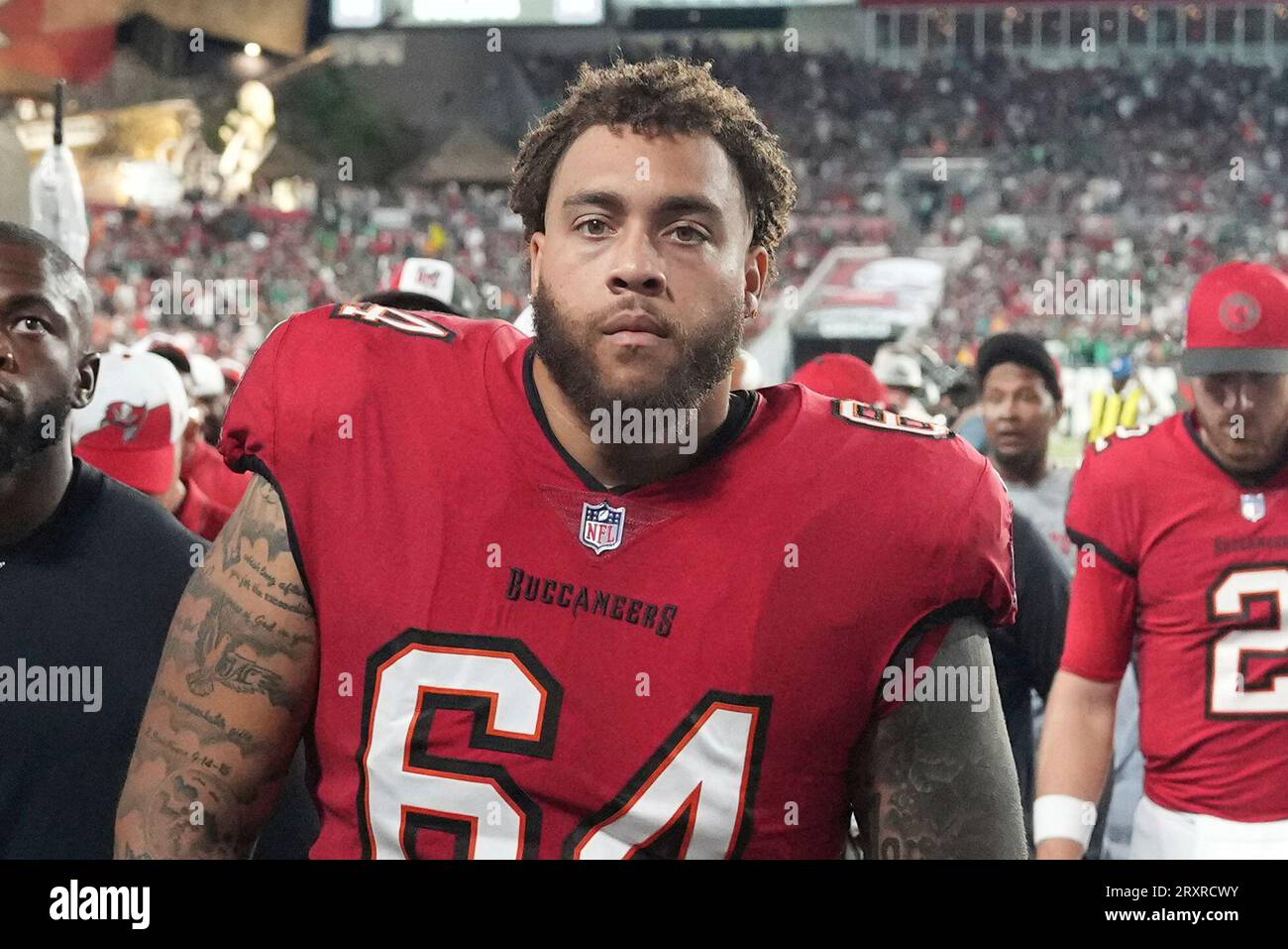 Tampa Bay Buccaneers guard Aaron Stinnie (64) exists the field at half ...