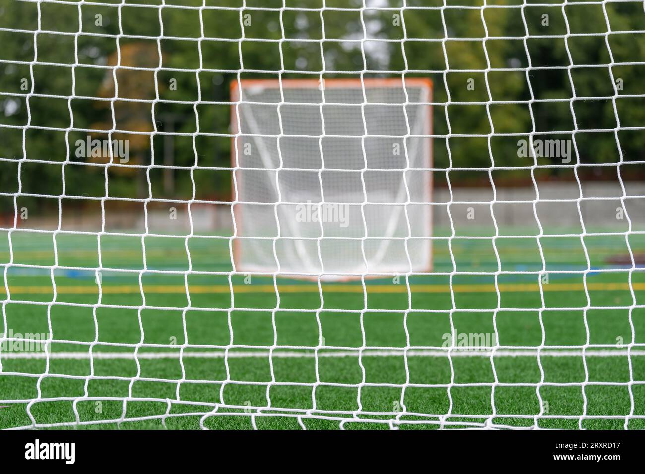 Photo of a lacrosse goal on a empty green synthetic turf field Stock ...