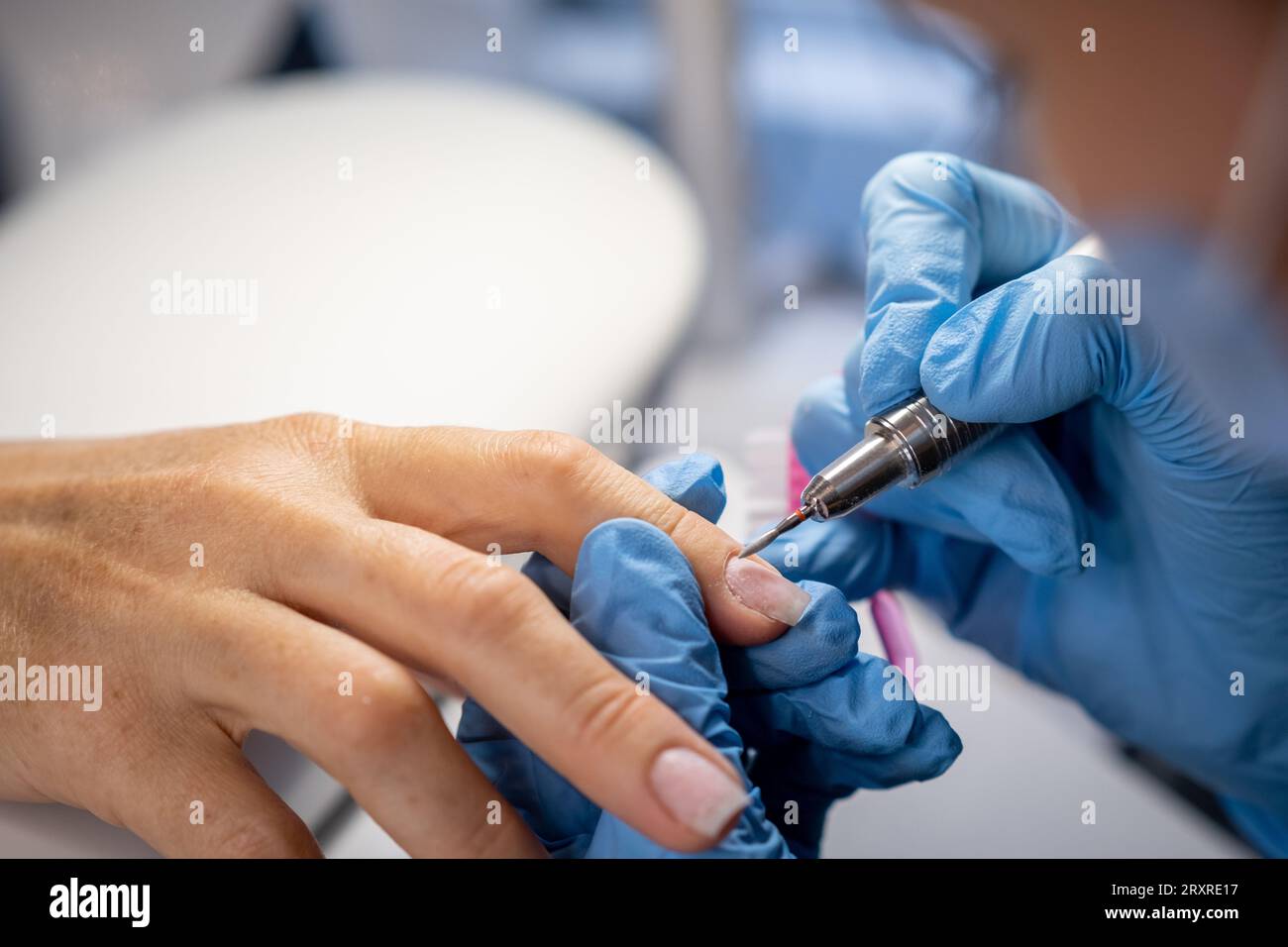 Female hands and tools for manicure, process of performing manicure ...