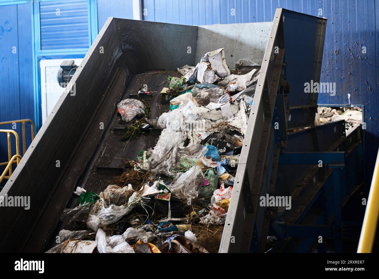 Large container and belt conveyors transporting garbage Stock Photo - Alamy