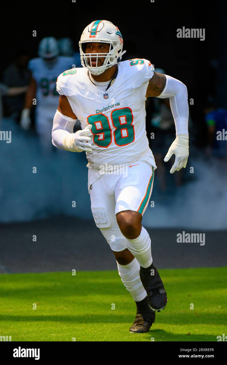 Miami Dolphins defensive tackle Raekwon Davis (98) runs onto the field ...