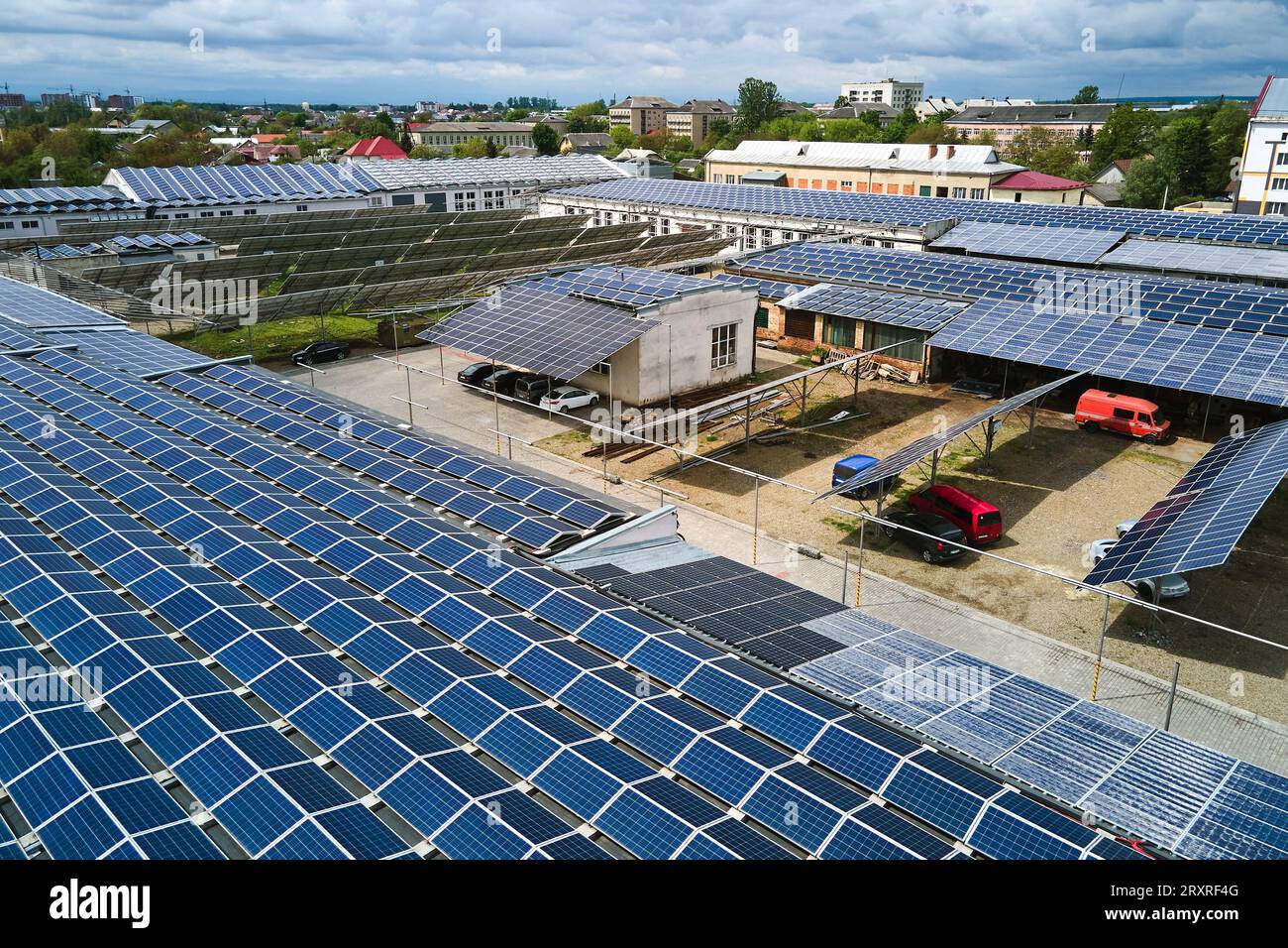 Aerial view of solar power plant with blue photovoltaic panels mounted ...