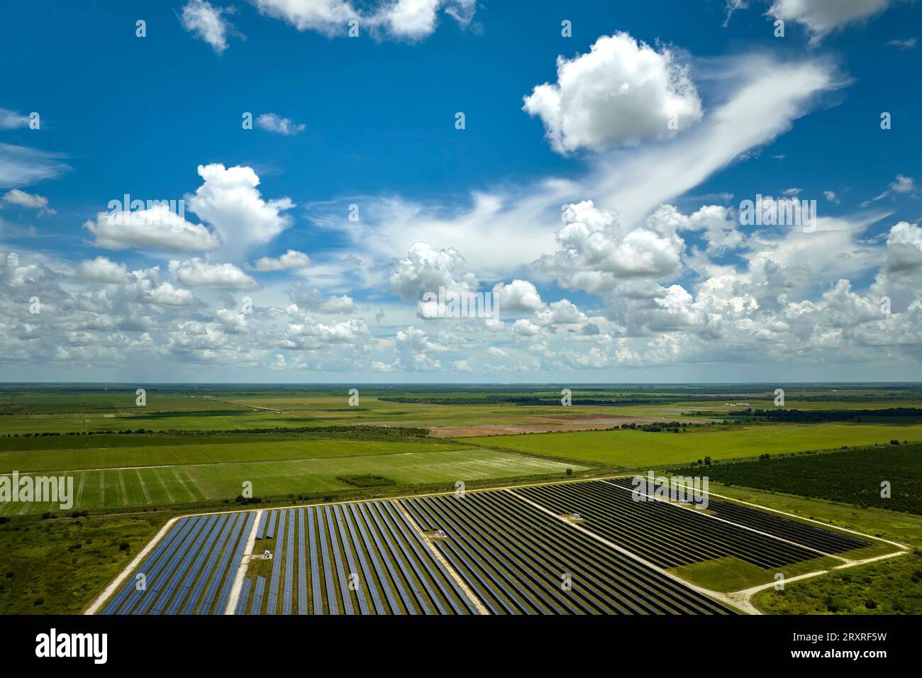 Aerial view of sustainable electric power plant between agricultural ...
