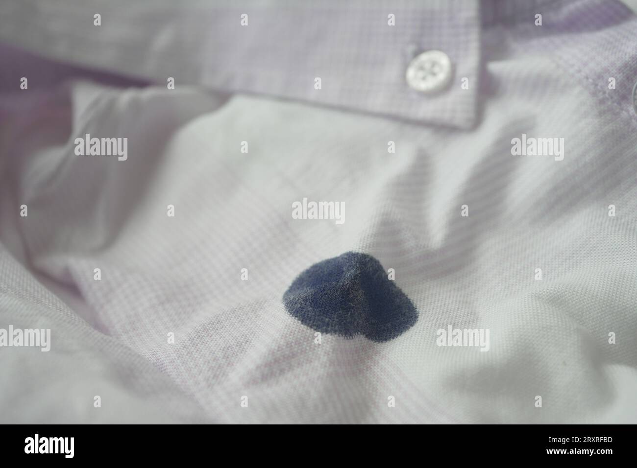 white shirt with blue ink stain Stock Photo - Alamy