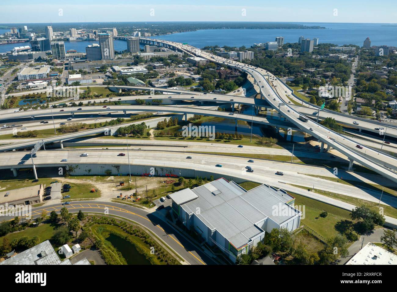American freeway intersection with fast driving cars and trucks. View ...