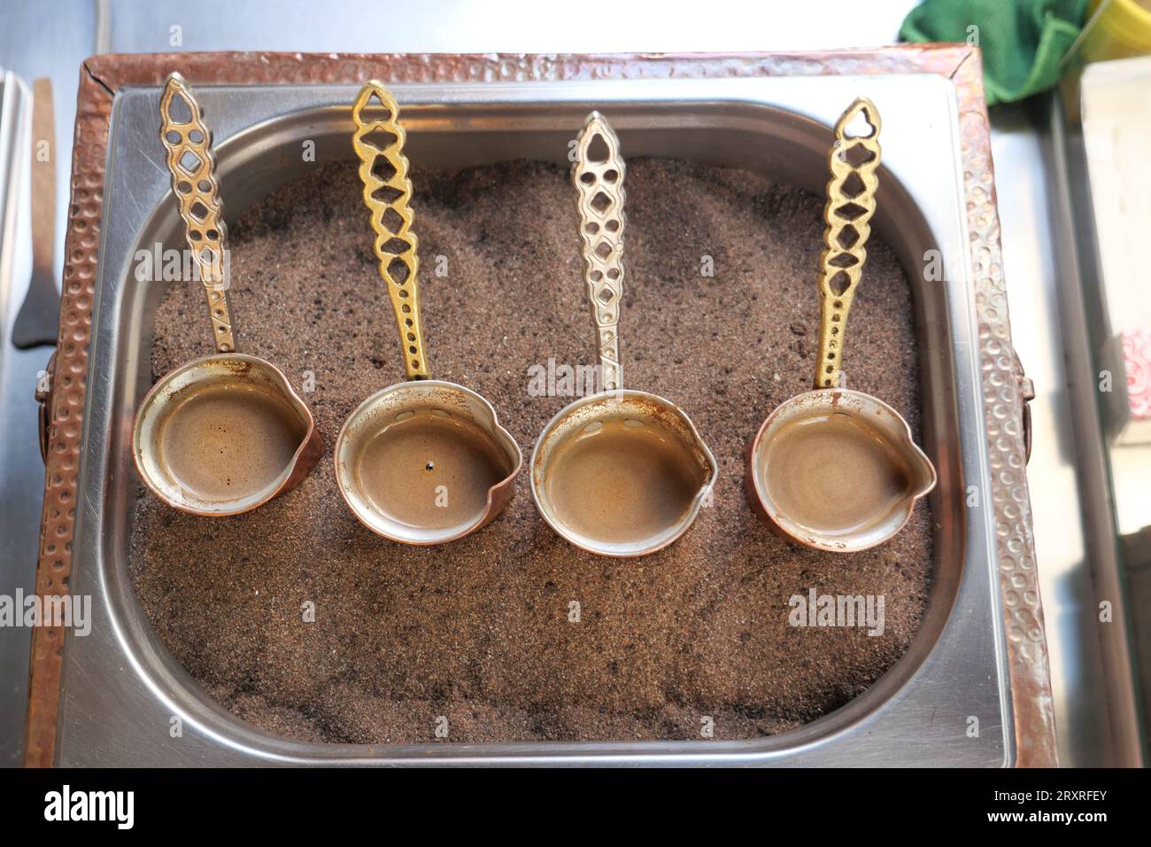 top view of making traditional turkish coffee on sand Stock Photo - Alamy