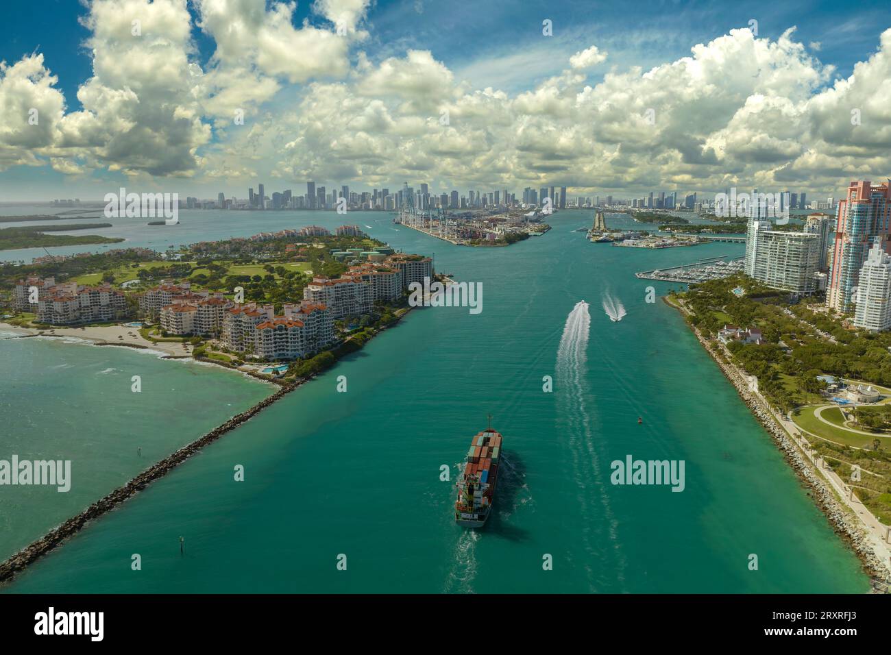 Commercial container ship entering Miami port harbor through main ...