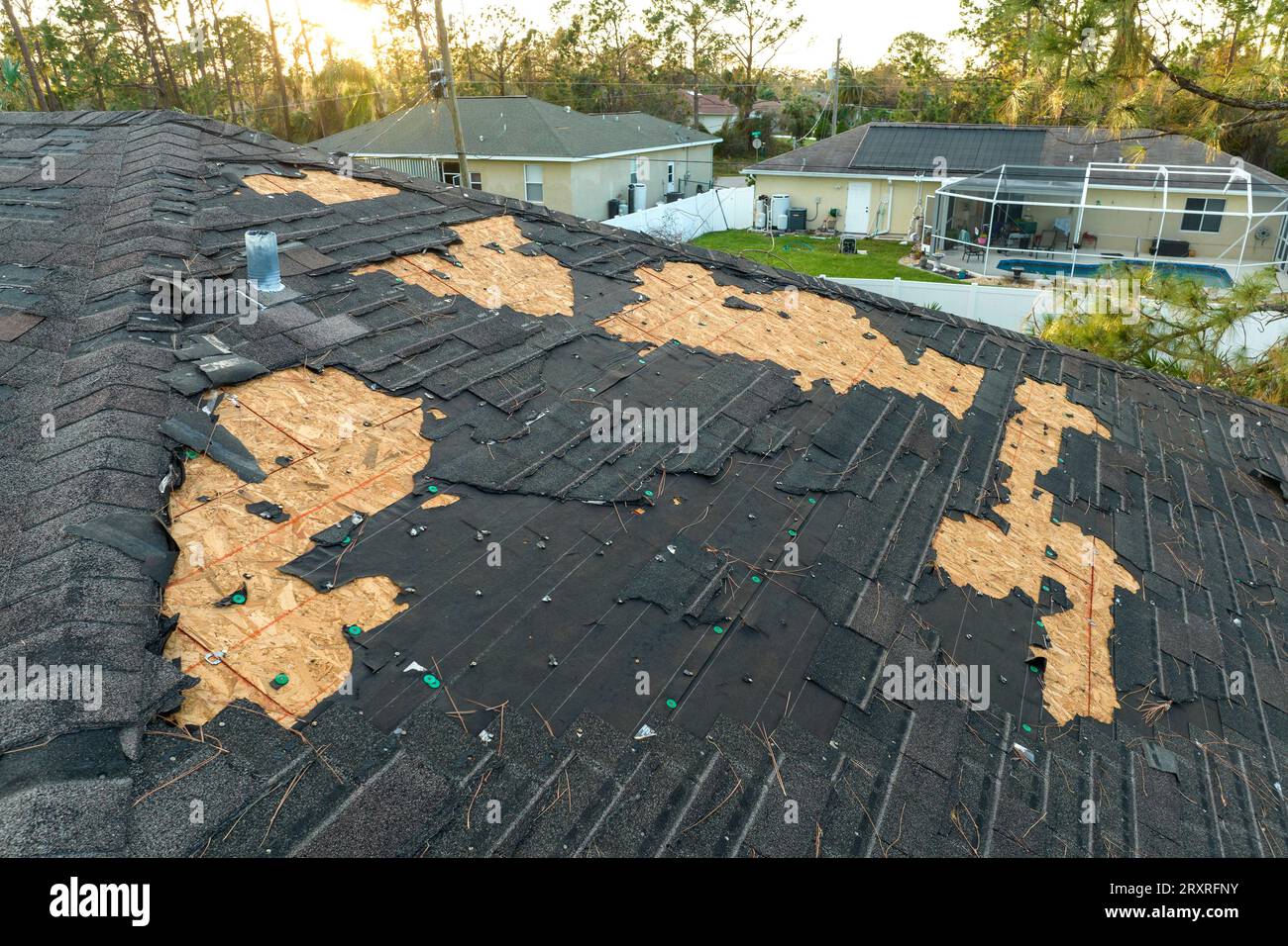 Consequences of natural disaster. Damaged house roof with missing ...