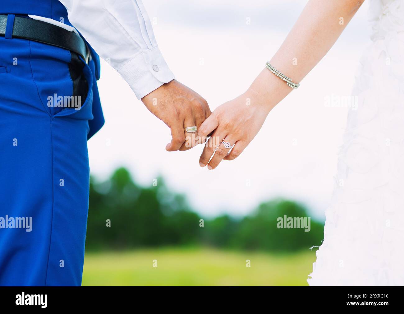Married holding hand hi-res stock photography and images - Alamy