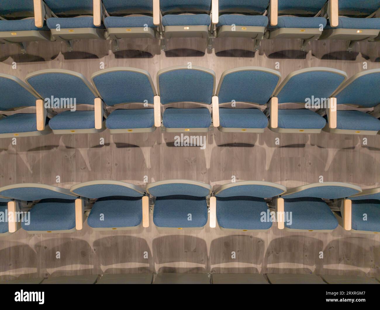 Overhead view of empty gray and blue theater, auditorium seats, chairs ...