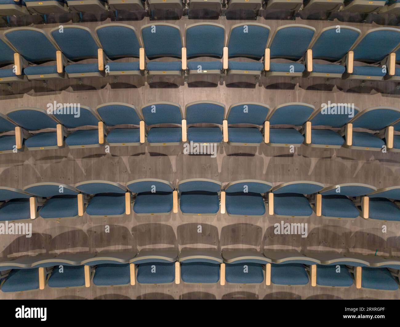Overhead view of empty gray and blue theater, auditorium seats, chairs ...