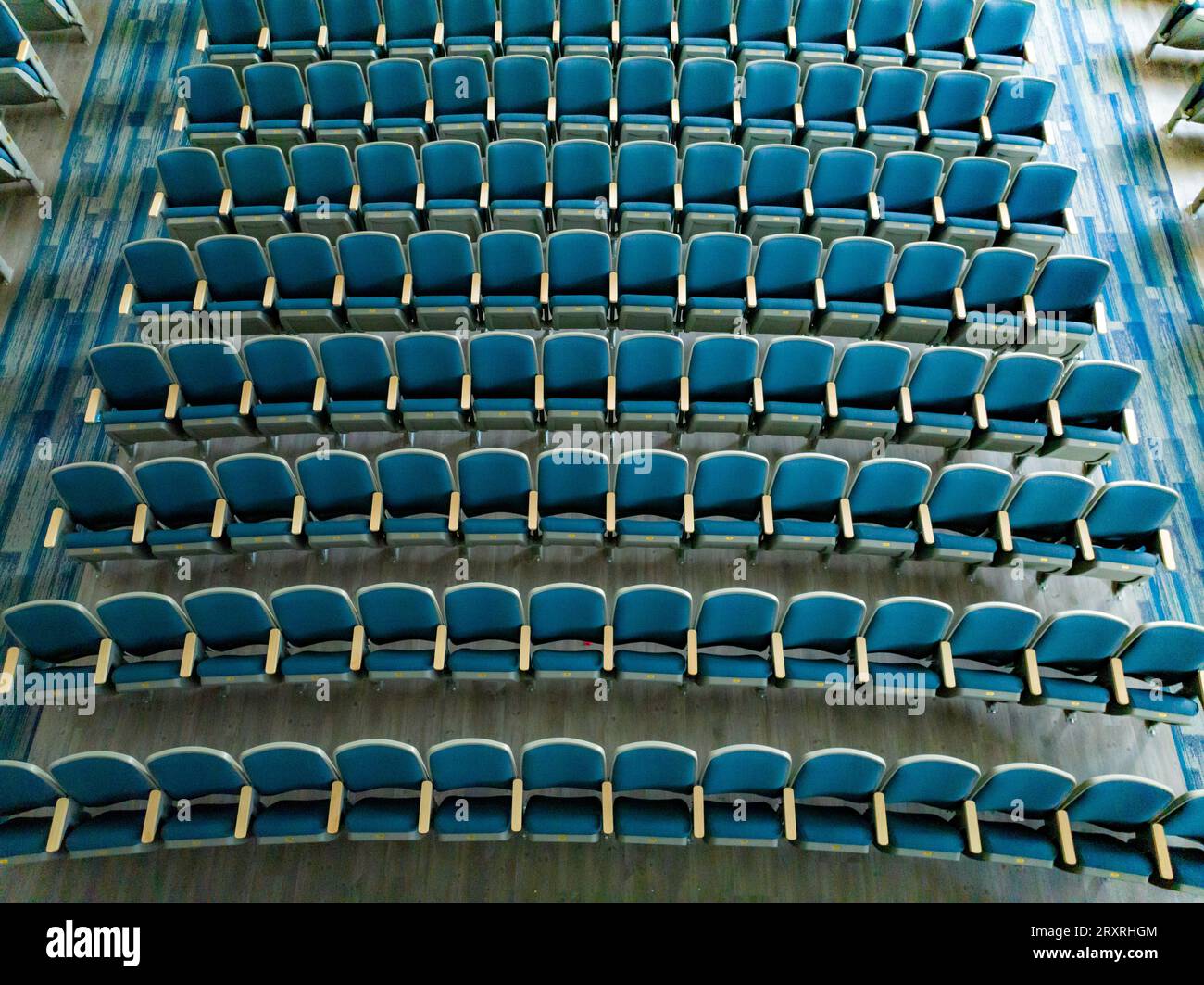Overhead view of empty gray and blue theater, auditorium seats, chairs ...