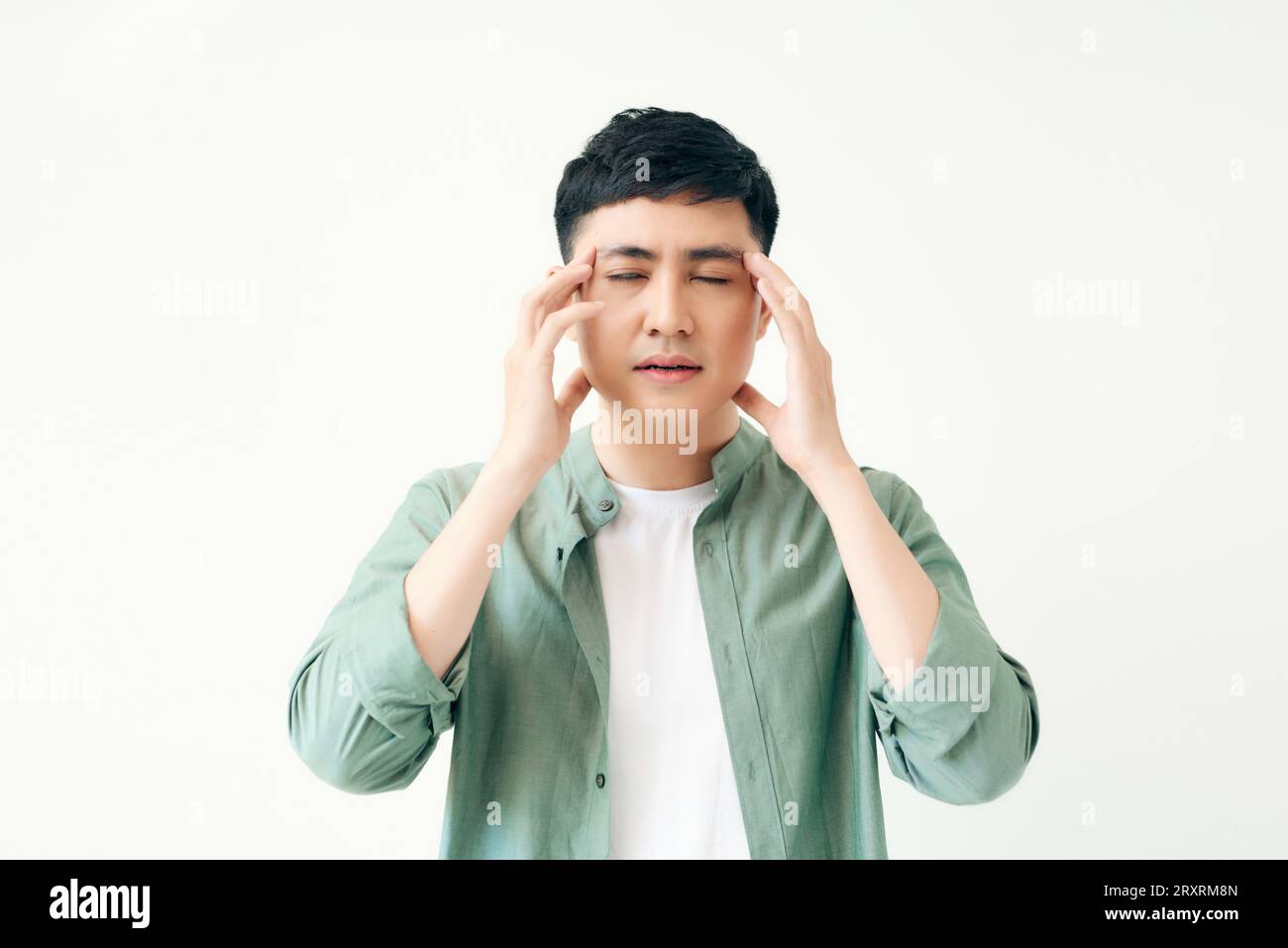man feel headache with white background, asian Stock Photo - Alamy
