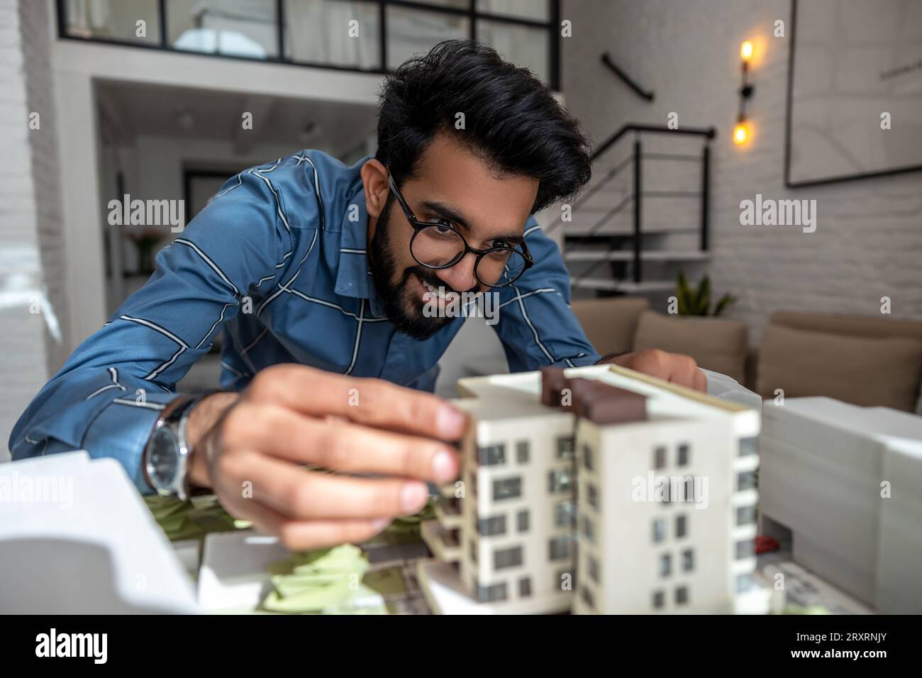 Young engineer with a house mock up Stock Photo - Alamy