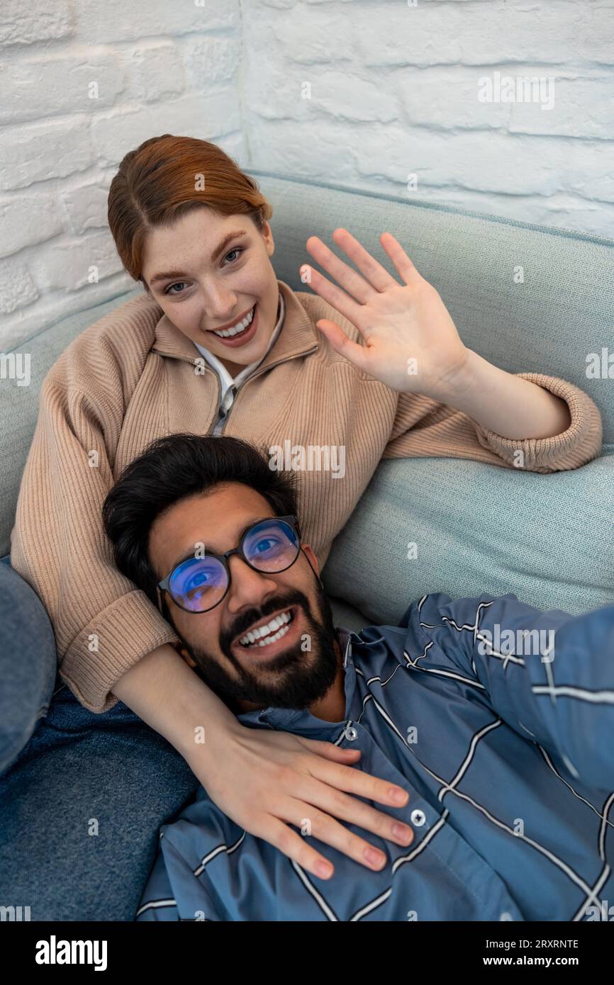 Happy man woman waving hands hi-res stock photography and images - Alamy