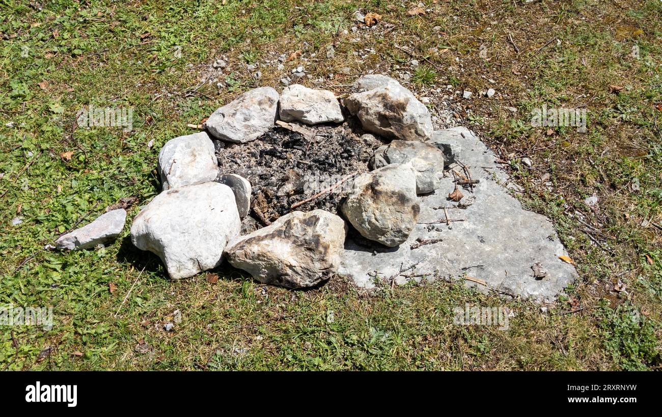 extinct fire pit stones for picnic campfire outdoor Stock Photo - Alamy