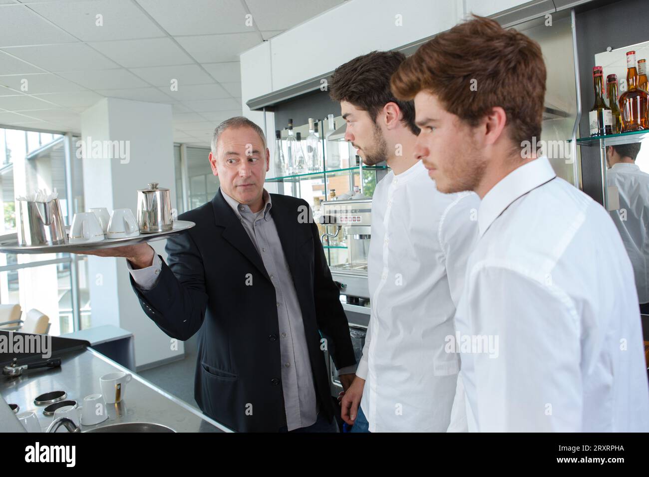 restaurant and hospitality service apprentice Stock Photo - Alamy