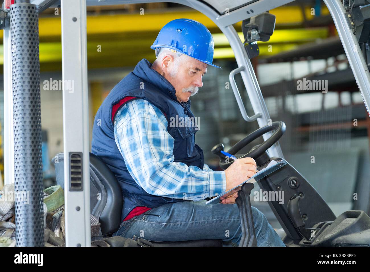 elderly forklift operator Stock Photo - Alamy