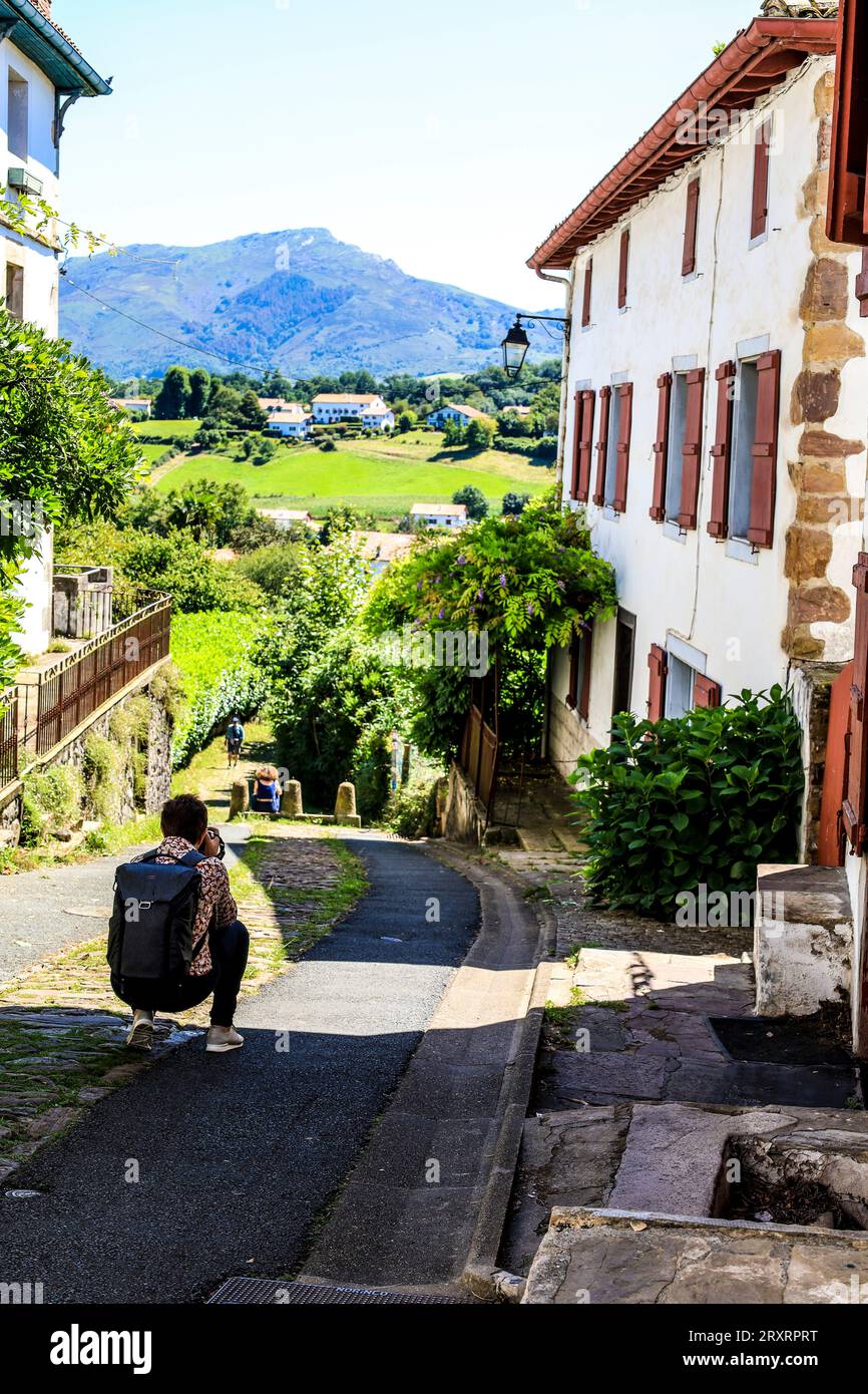 Sare, France- August 14, 2023: Narrow street in the center of Sare, a ...