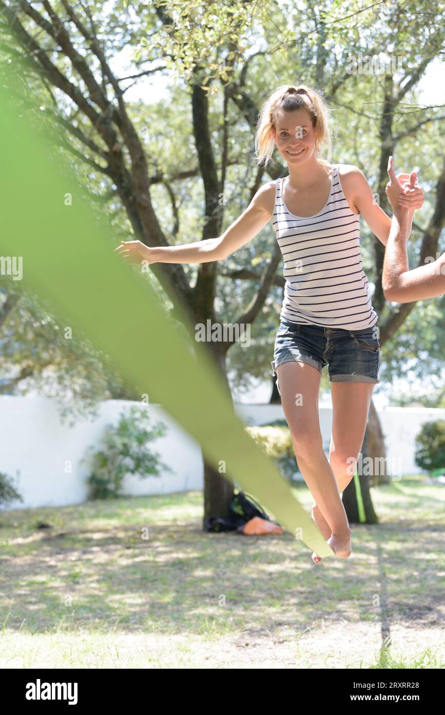 Slack line and female hi-res stock photography and images - Alamy