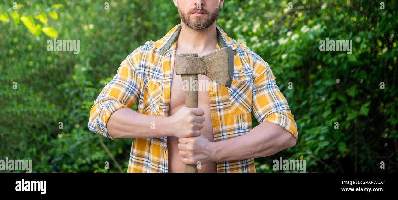 cropped view of lumberjack with axe outdoor. photo of lumberjack with ...