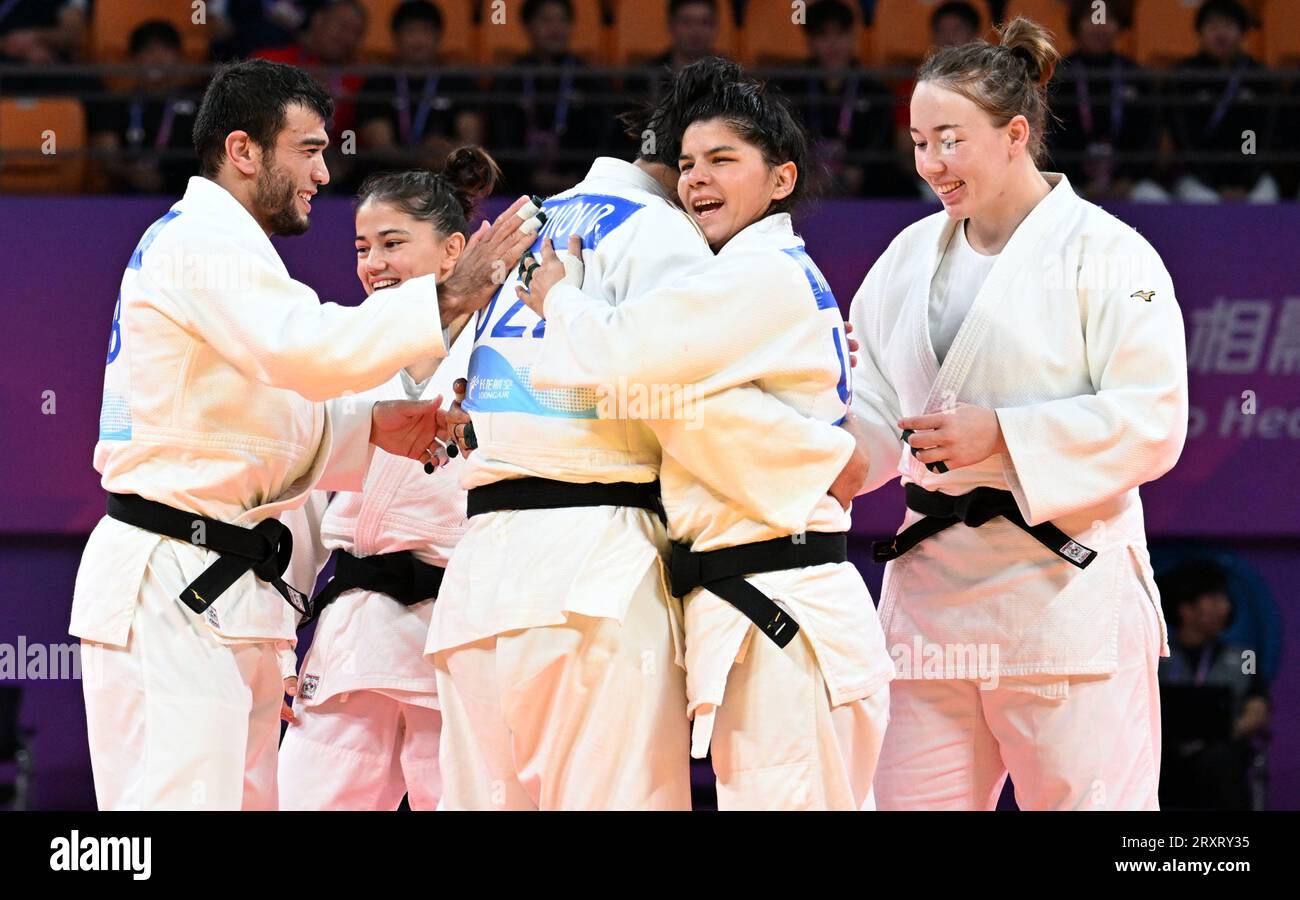 HANGZHOU, Sept. 27, 2023 (Xinhua) -- Team Uzbekistan celebrate after ...