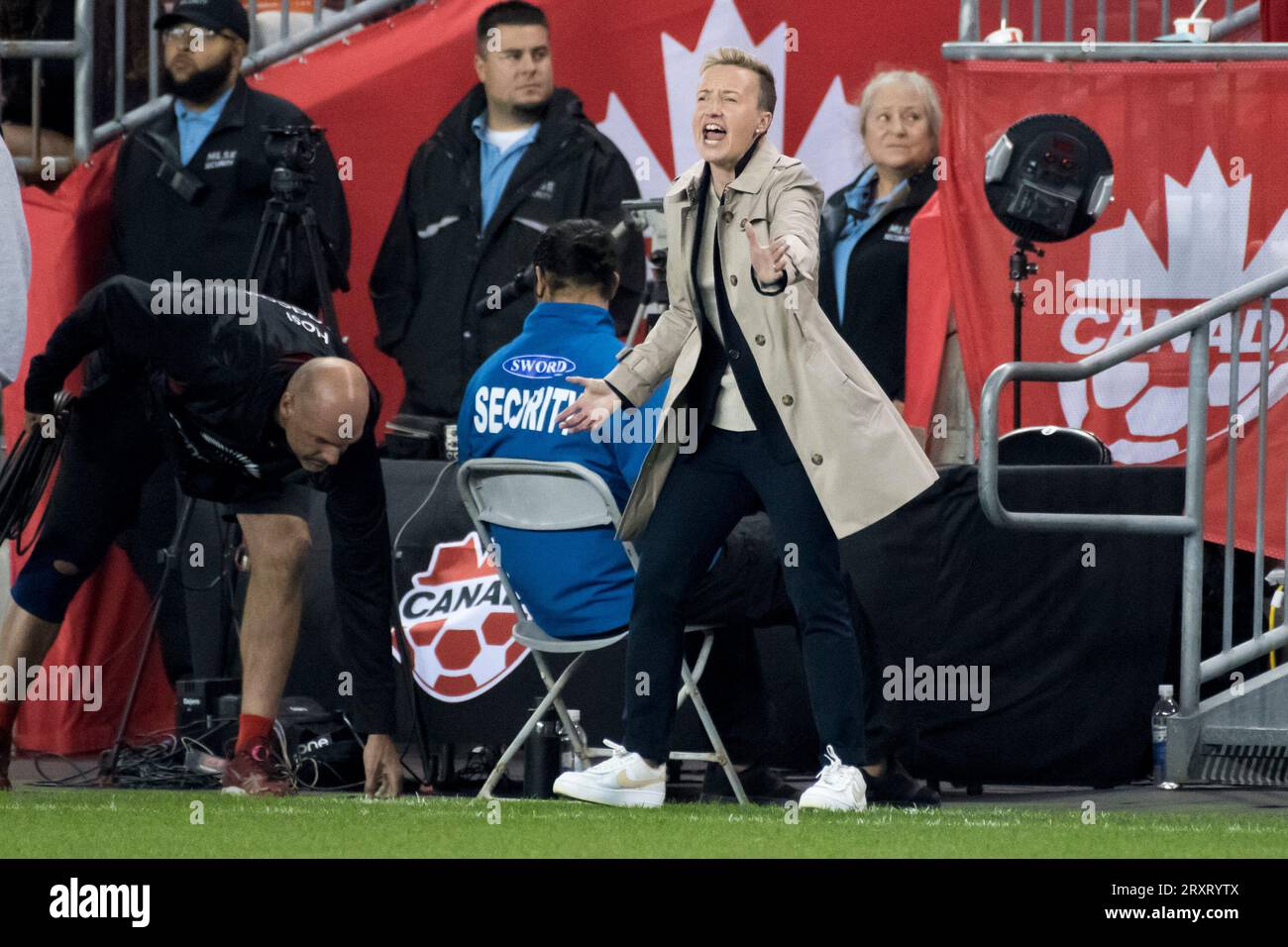Beverly Priestman, coach of Canada, is seen in the bench, in action ...