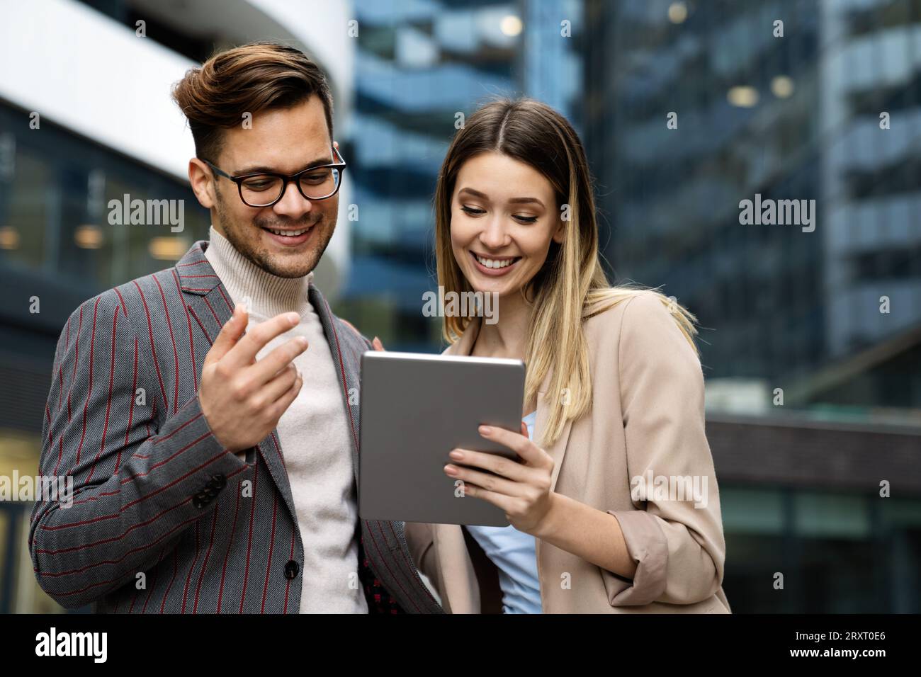 Successful business people, designer enjoying work together. Business ...