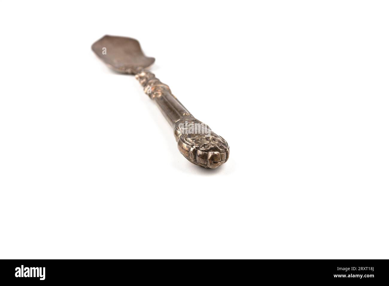 vintage silver spoon used for praline and sugar isolated on white ...