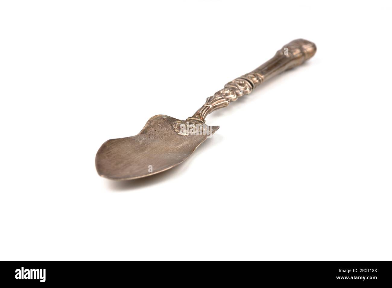 vintage silver spoon used for praline and sugar isolated on white ...