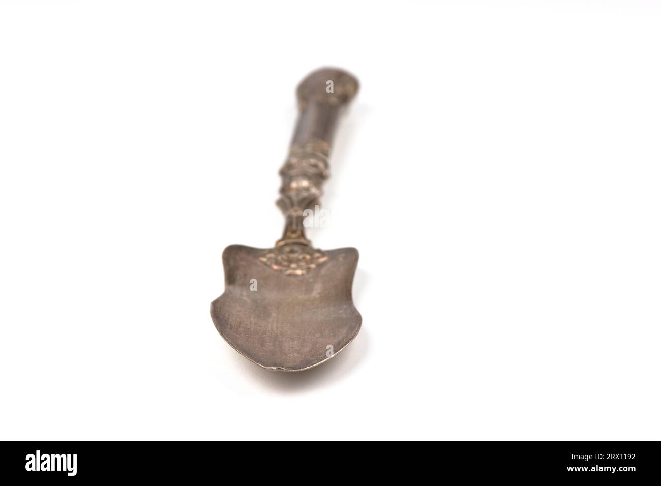 vintage silver spoon used for praline and sugar isolated on white ...