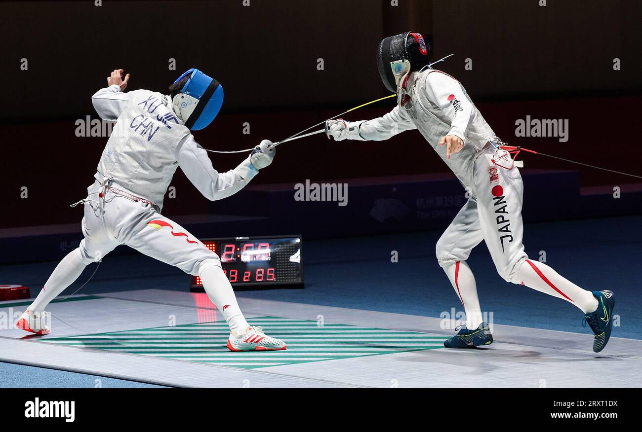 HANGZHOU, Sept. 27, 2023 (Xinhua) -- Xu Jie (L) of China competes ...