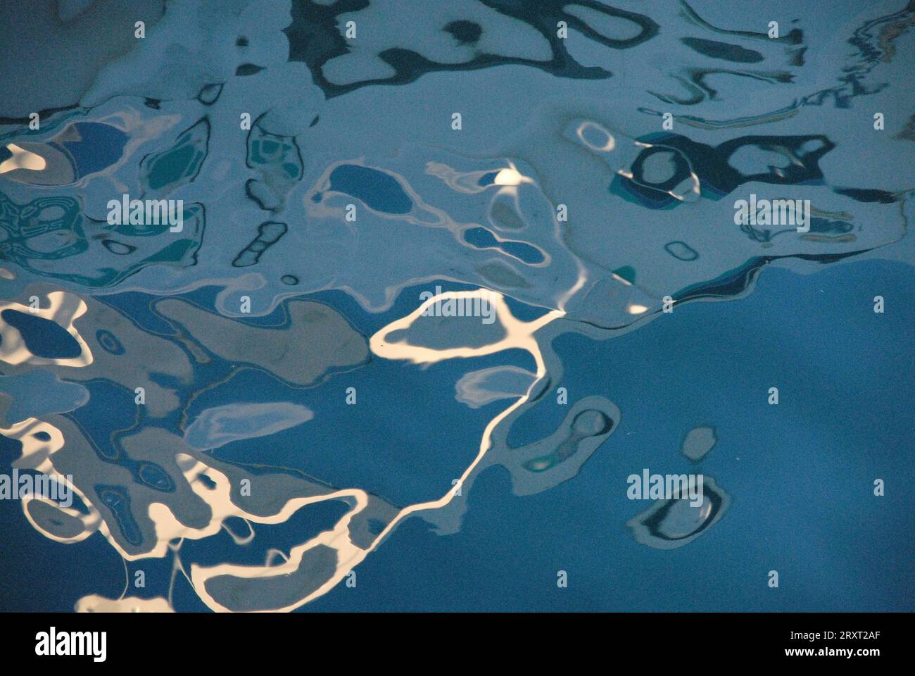 Blue liquid background with water ripple reflection, abstract or ...