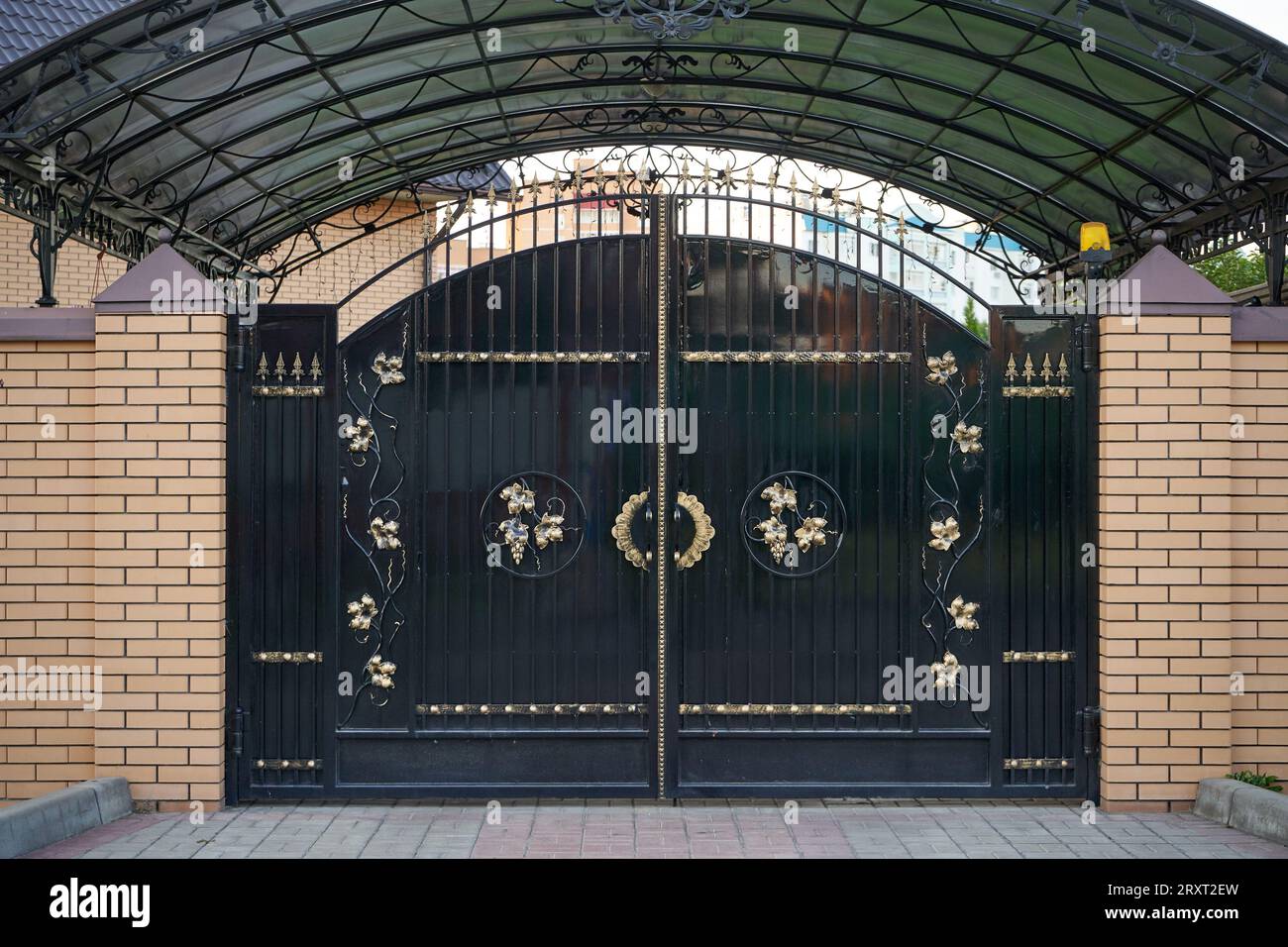 Black metal forged gates in black Stock Photo - Alamy