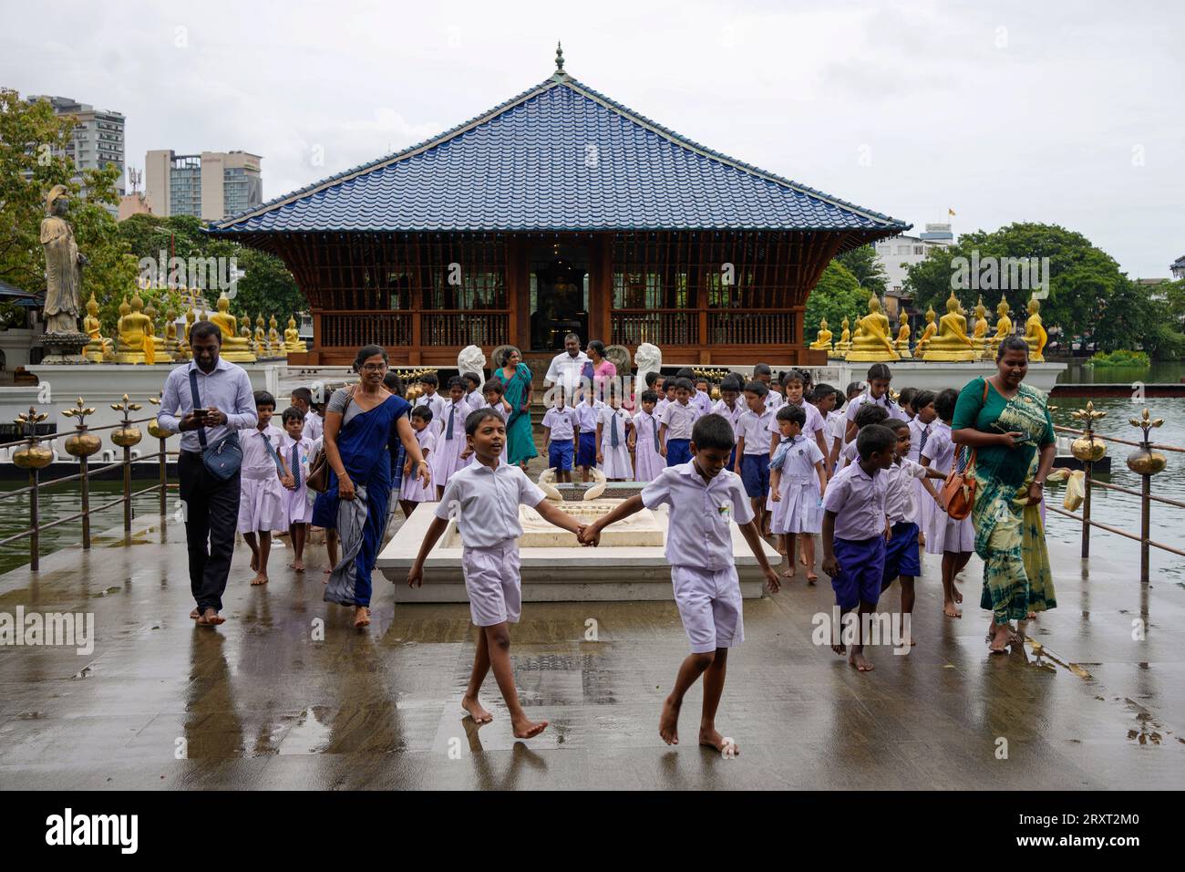 School children visit a Buddhist shrine which is also a popular tourist ...