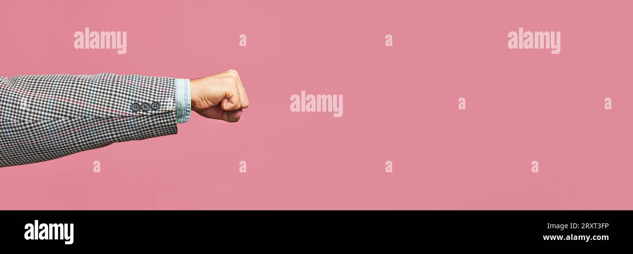 Banner. Poster. Male hand showing palm fist isolated on pastel pink ...