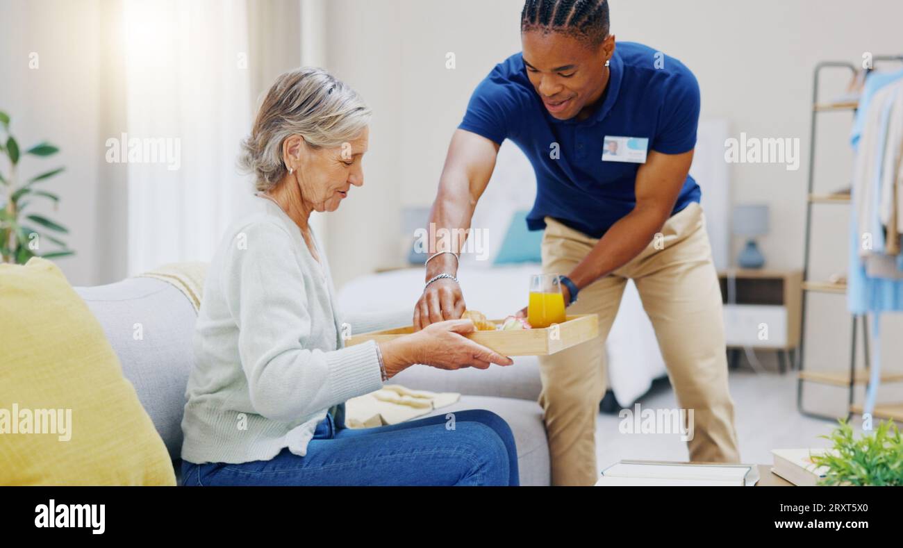 Breakfast, assisted living and retirement with a old woman on a sofa in ...