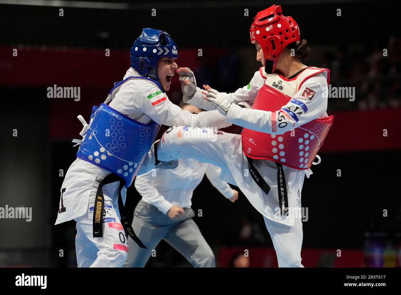 Feruza Sadikova of Uzbekistan, right, competes against Vakili Melika ...