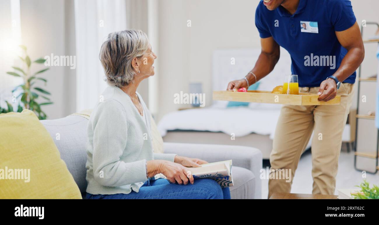 Breakfast, assisted living and retirement with a mature woman on a sofa ...