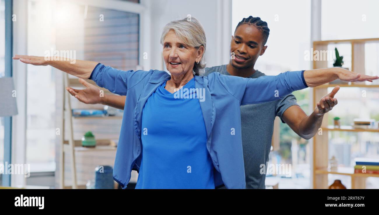 Elderly woman, nurse and rehabilitation or stretching exercise in a ...