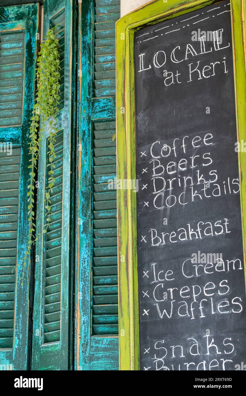 menu board outside of a greek restaurant or taverna with painted rustic ...