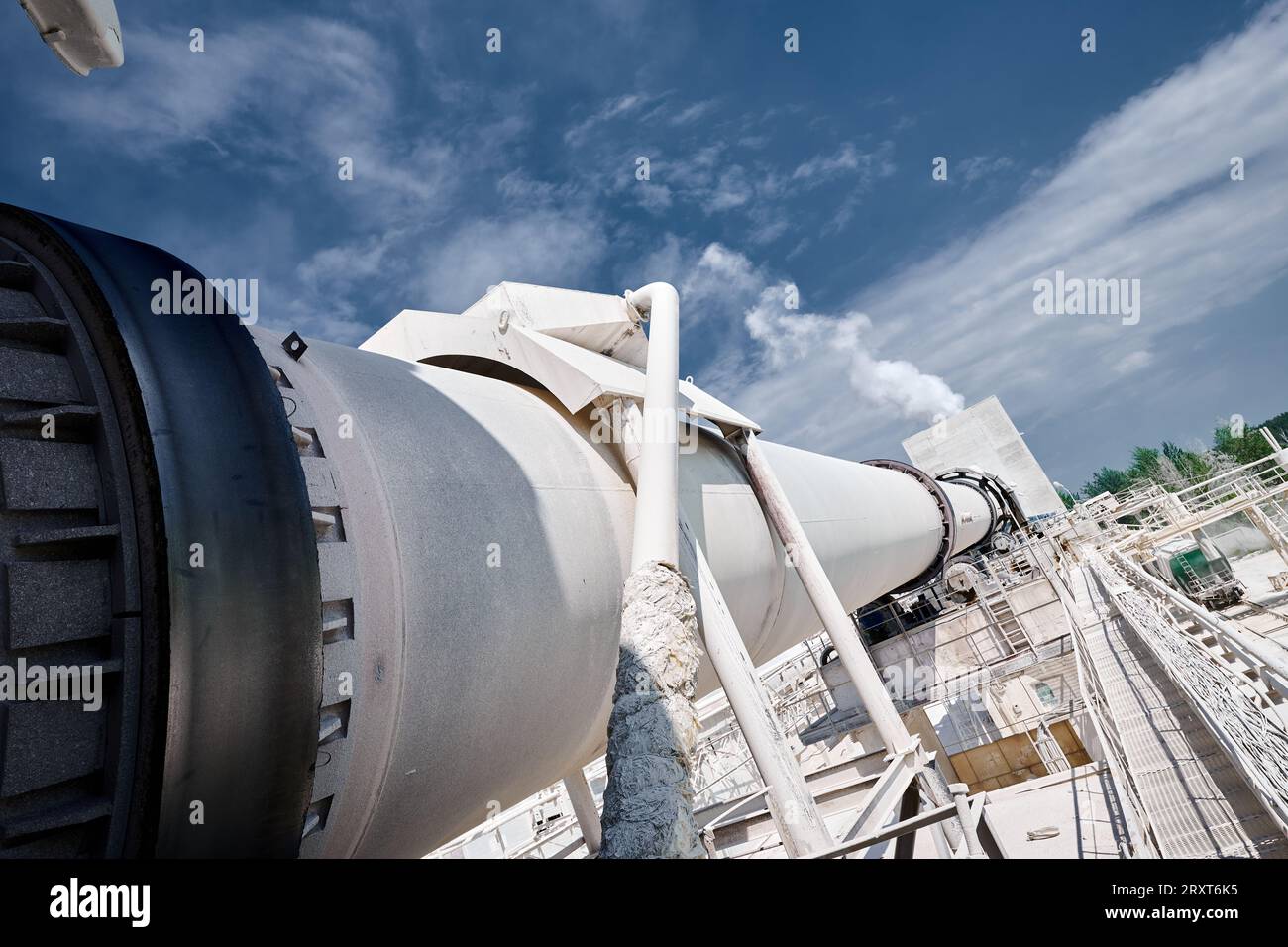 Rotary lime kiln at manufacturing complex under blue sky Stock Photo ...