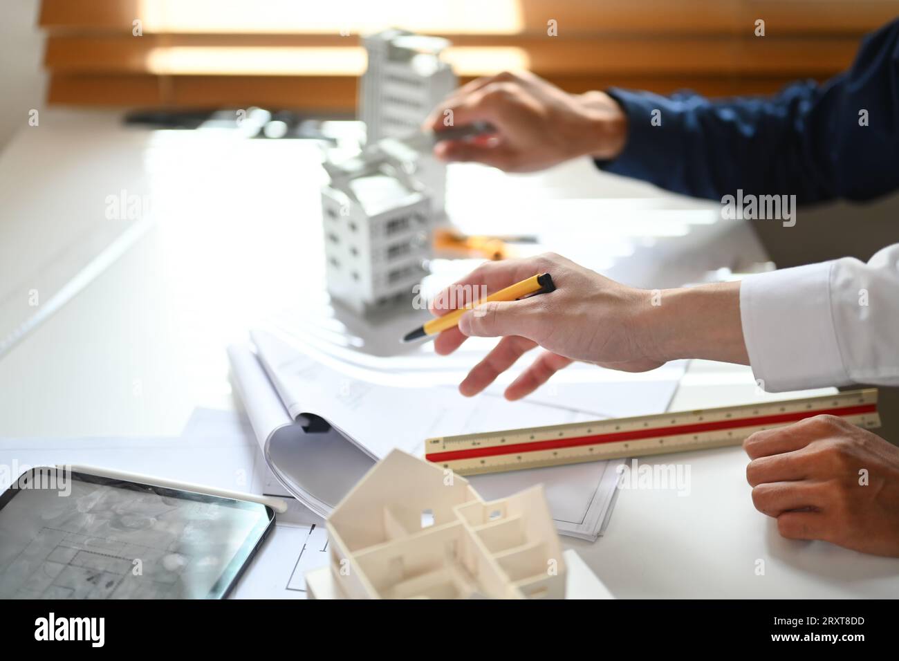Architects man having briefing about project reviewing blueprints at co ...