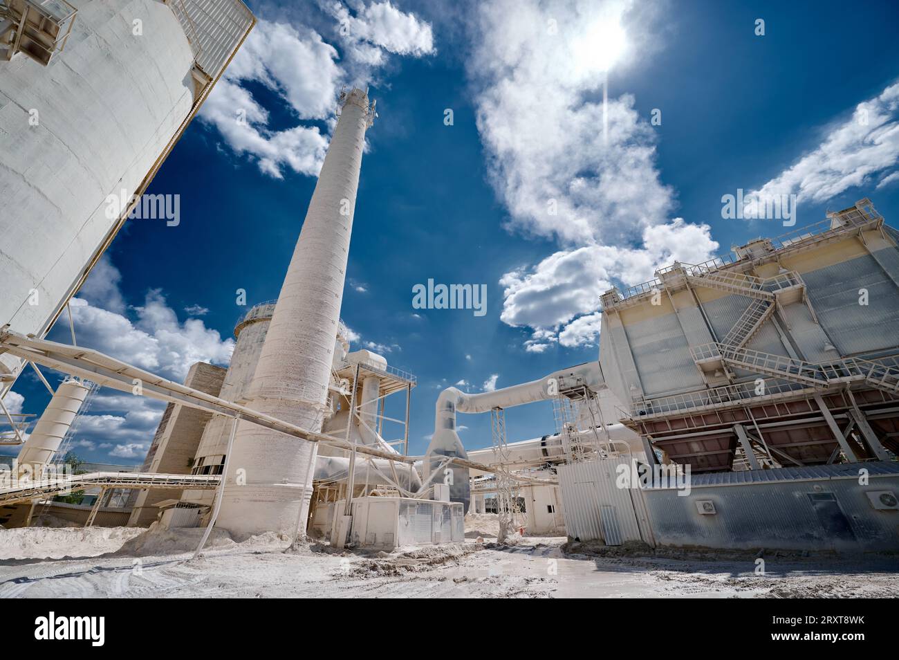 High concrete silos for storage of finished lime products Stock Photo ...