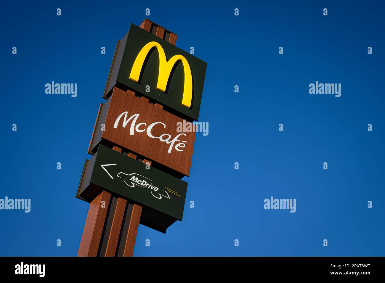 McDonald's, McCafe and McDrive logos are seen on a sign above a fast ...
