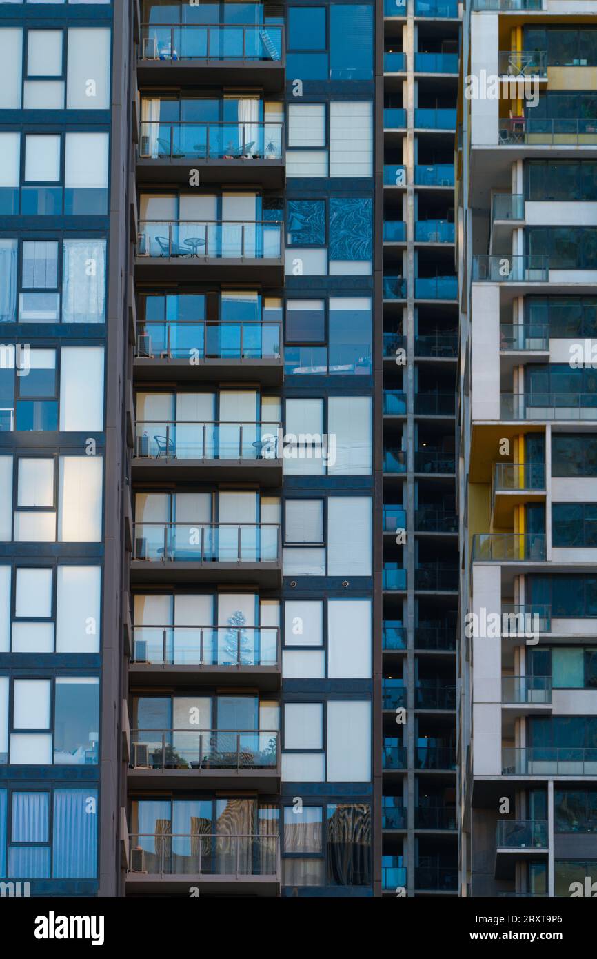 Modern city building apartment block with balconies, windows and glass ...