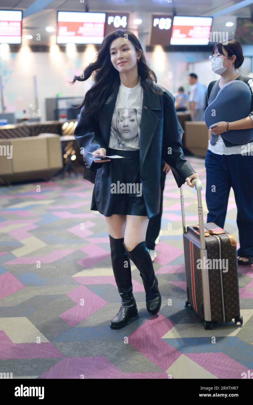 Hong Kong actress and fashion model Janice Man appears at the airport ...