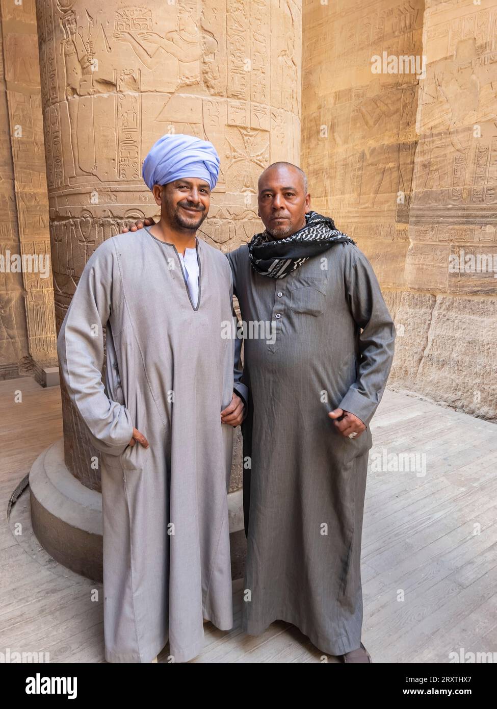 Two Egyptian men standing inside the Philae temple complex, The Temple ...