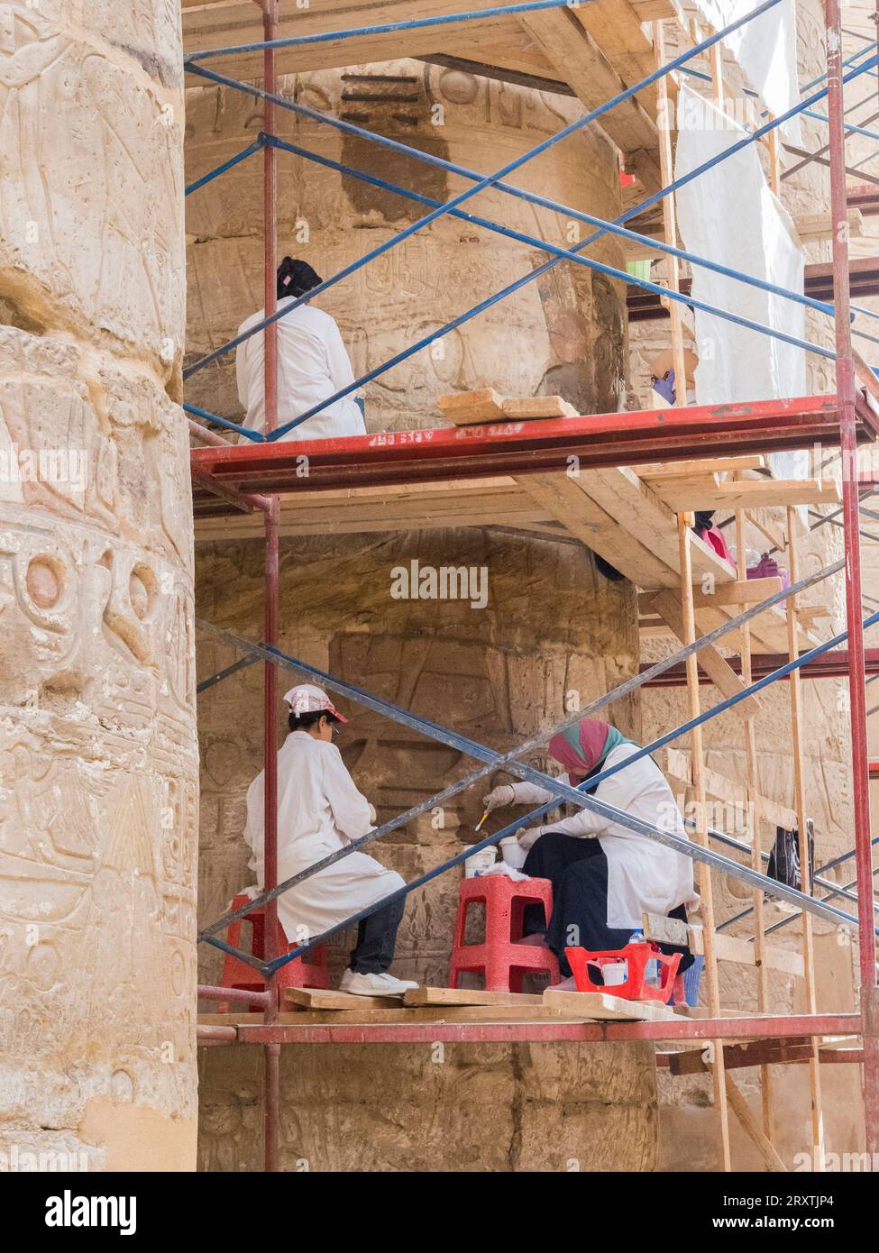 Workers at the Karnak Temple Complex, a vast mix of temples, pylons ...