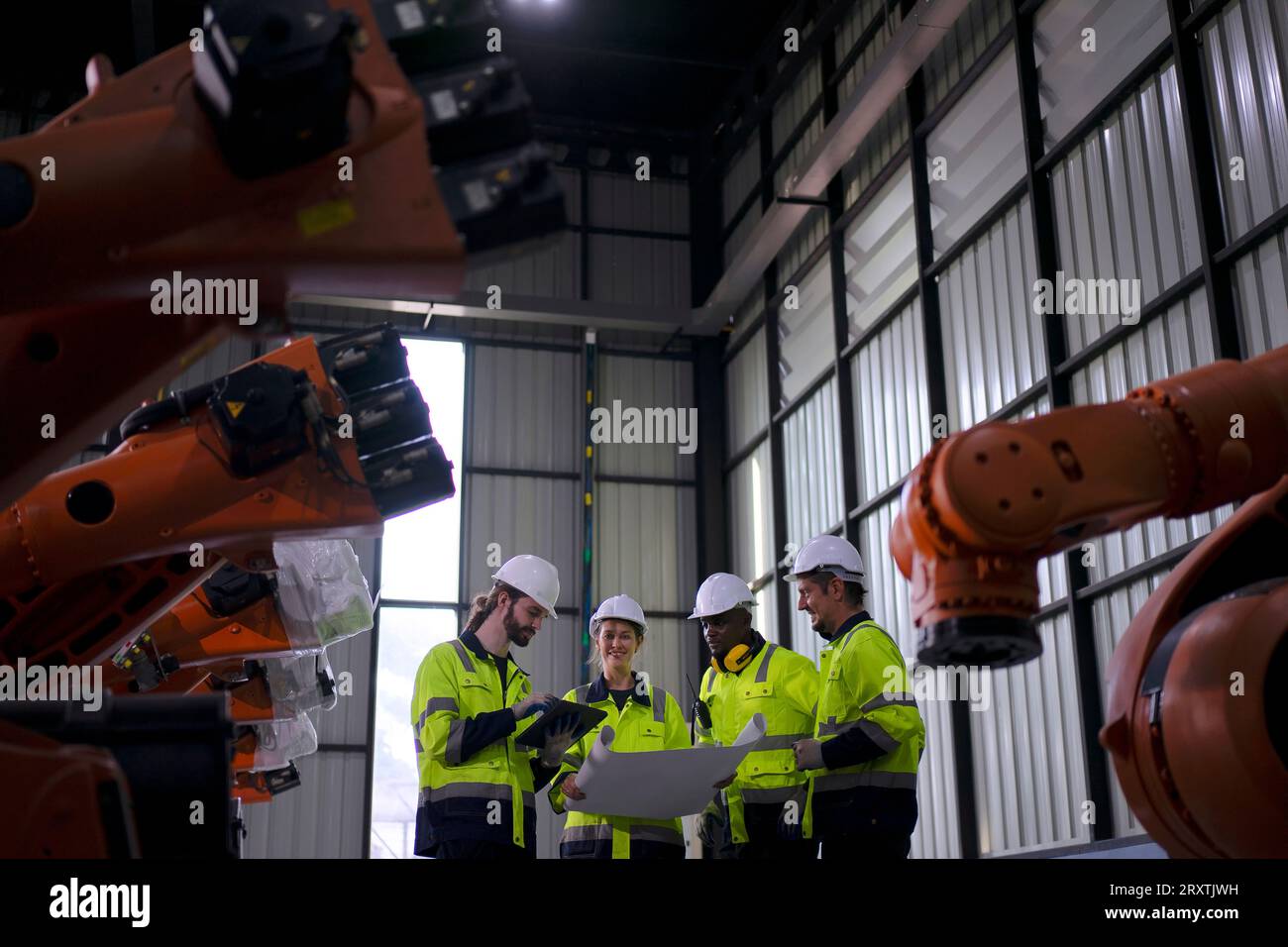 Engineer work at robotic arm factory. Technology and engineering concept Stock Photo - Alamy